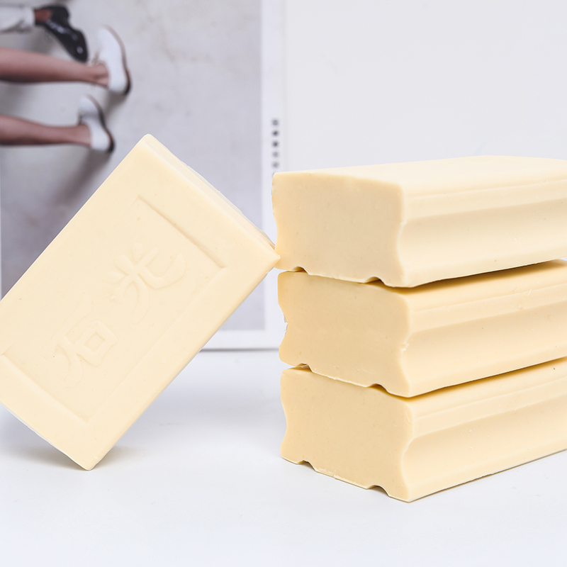 Whitening and stain removing solid laundry soap